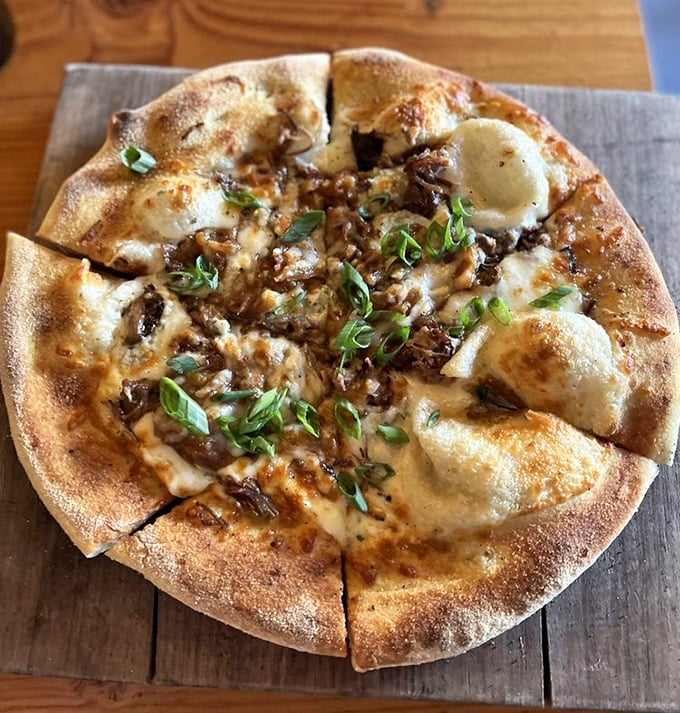 Pizza perfection with a blistered crust that whispers sweet nothings to your taste buds. The melted cheese and caramelized toppings are having their own little party.