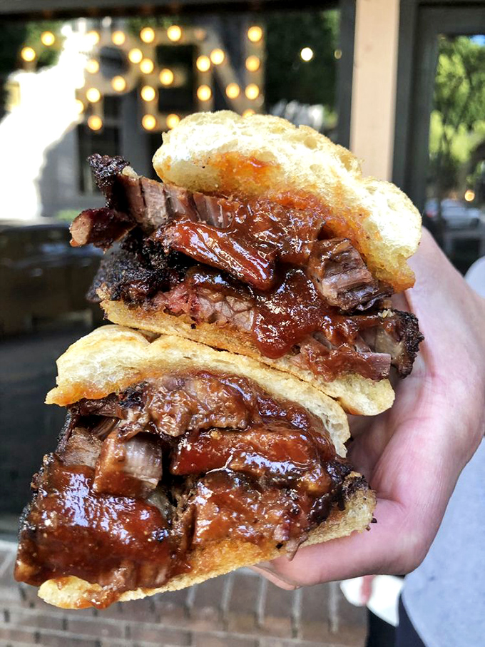 A brisket sandwich that requires both hands and your undivided attention. This isn't a meal &ndash; it's a commitment.