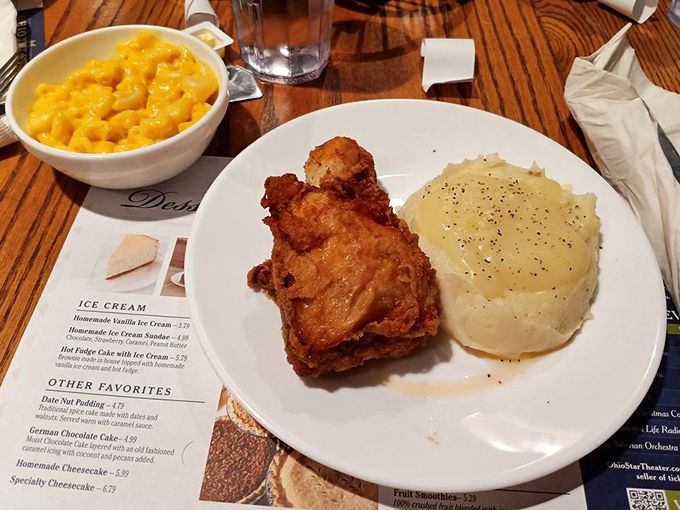 Broasted chicken so perfectly golden it deserves its own trophy, alongside mashed potatoes that have clearly never met a box in their life.