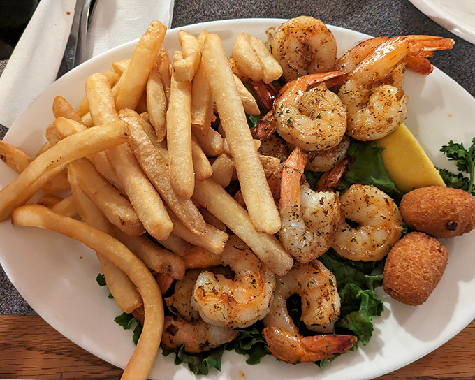 Perfectly grilled shrimp nestled beside golden fries and hush puppies&mdash;a trio more harmonious than The Supremes in their prime.