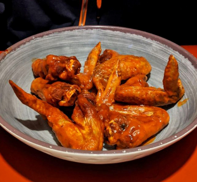 Buffalo wings that don't mess around&mdash;crispy, saucy, and unapologetically messy. Your fingers will be orange, your mouth will be happy, and napkins will be essential.