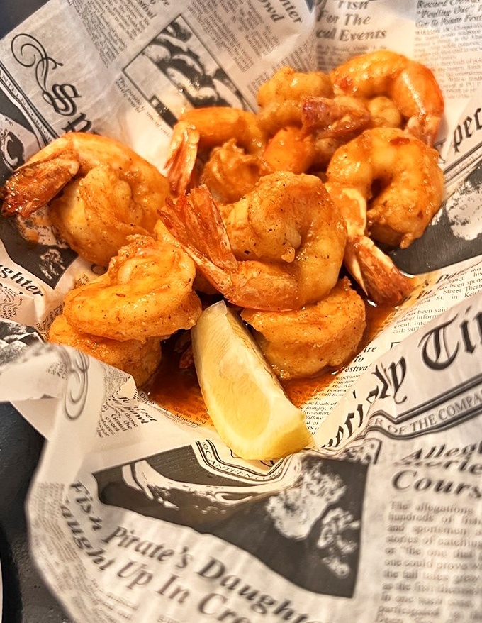 Fried shrimp served on newspaper&mdash;because when seafood is this good, fancy plates would just get in the way of the relationship.