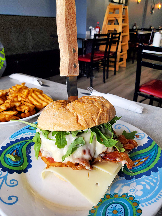 This isn't just a sandwich; it's a towering achievement of breakfast architecture with arugula adding a peppery sophistication to comfort food.