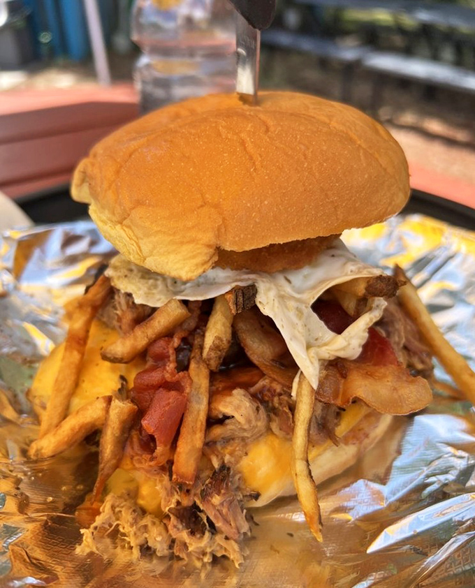 Not just a burger&mdash;it's an architectural marvel. Layers of pulled pork, fries, and cheese create a tower of power that requires both hands and zero shame. 