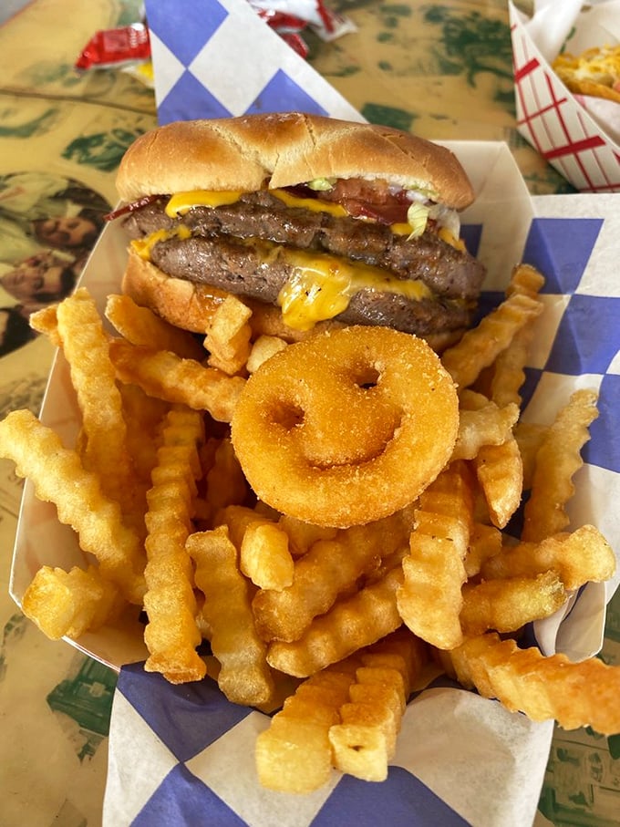 Behold the Snow Cap burger in its natural habitat&mdash;surrounded by crispy fries and that signature smiley-faced onion ring that's practically winking at you.