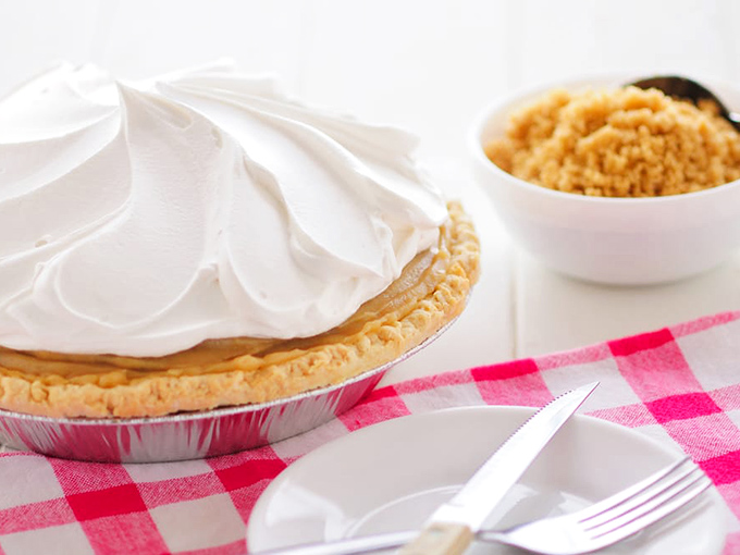 Butterscotch pie crowned with whipped cream peaks that rival the Swiss Alps in beauty.