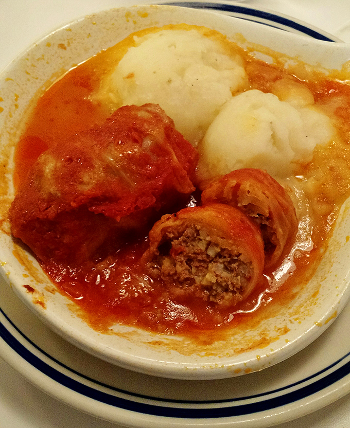 The legendary cabbage rolls&mdash;tender cabbage embracing seasoned meat and rice, swimming in a tomato sauce that's been perfecting itself since Elvis was king.