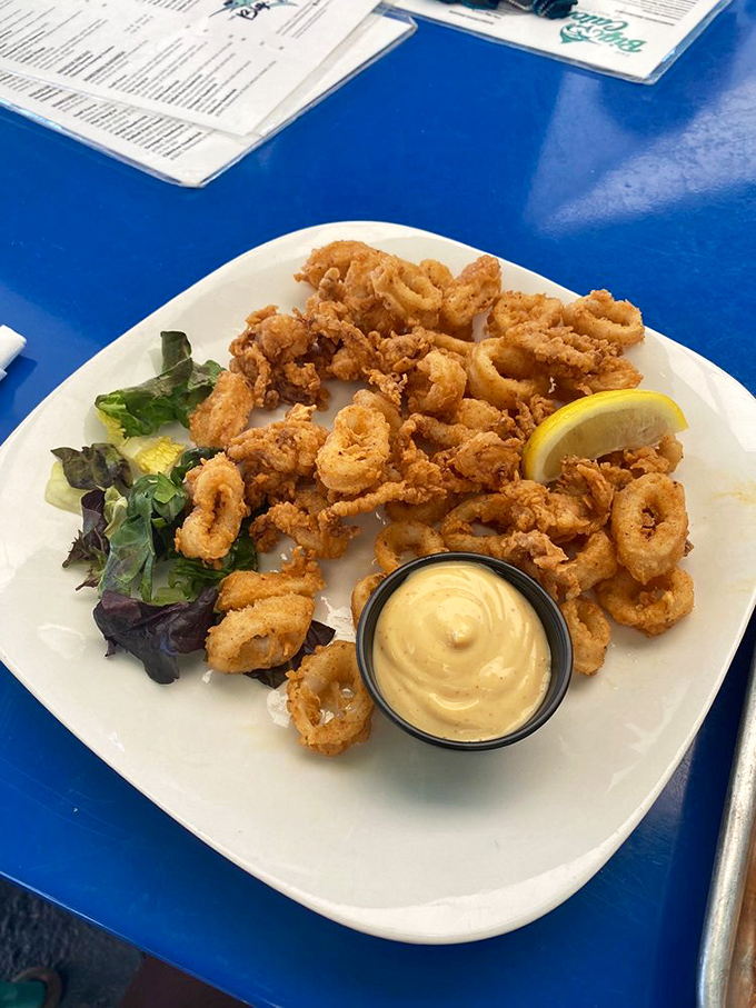 Golden-fried calamari that's tender, not rubbery &ndash; the unicorn of seafood appetizers &ndash; served with a lemony dipping sauce. 