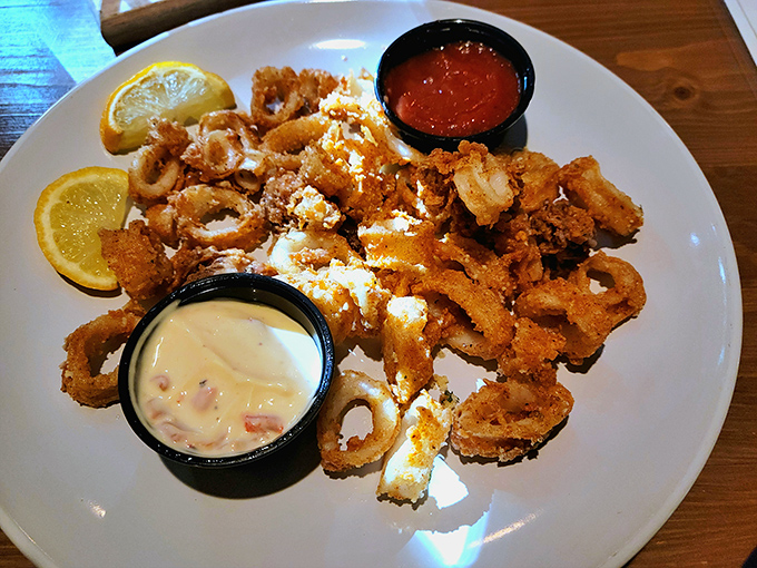 Golden-fried calamari that shatters with each bite, served with dipping sauces that make you wonder why you'd ever share this plate.