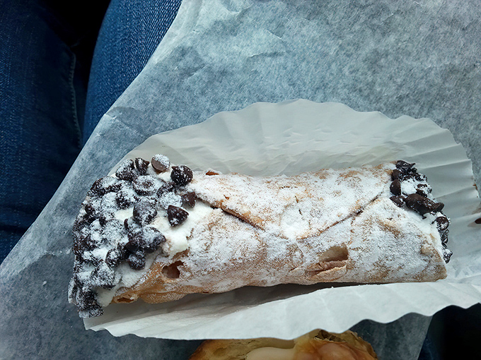 This cannoli isn't just a pastry&mdash;it's an edible love letter from Italy, dusted with powdered sugar and chocolate chips.