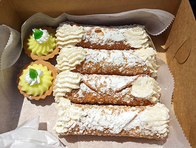 Cannoli so authentic they should come with their own passport &ndash; crisp shells filled with sweetened ricotta and topped with a dusting of powdered sugar.