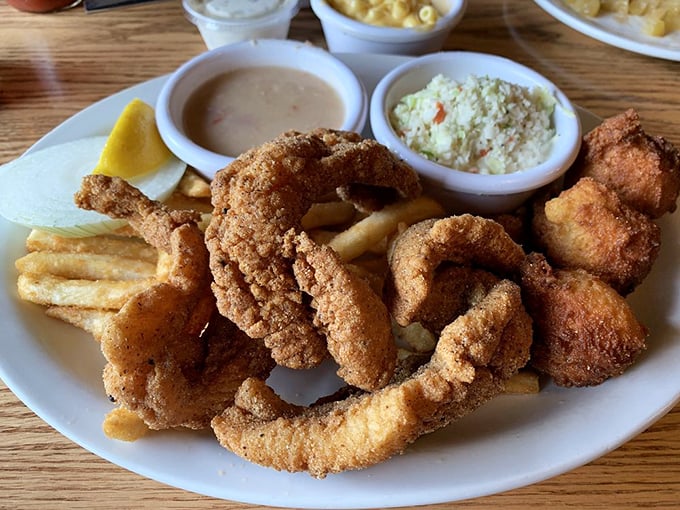 Catfish that's had a proper Southern baptism in cornmeal and hot oil. Paired with those crispy fries and creamy slaw, it's a holy trinity of flavor.