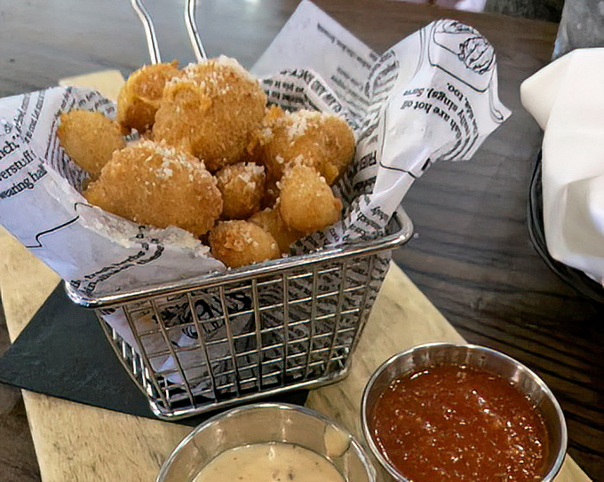 These golden cheese curds aren't just appetizers&mdash;they're little nuggets of joy that squeak between your teeth like edible stress relievers.