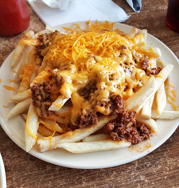 Behold the legendary club sandwich! Perfectly stacked layers of meat, cheese, and veggies held together by toothpicks and tradition.