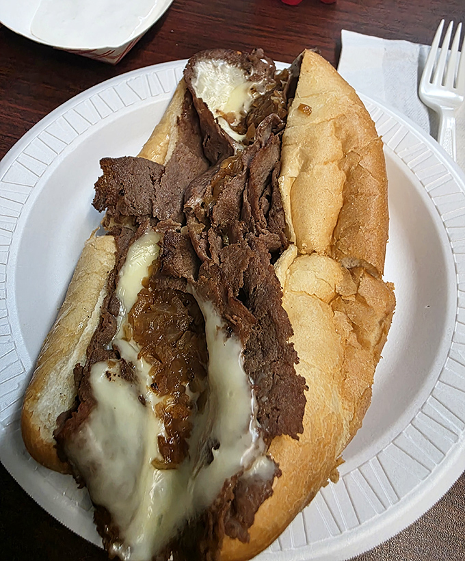 This cheese steak isn't trying to impress food critics; it's busy making memories for anyone lucky enough to experience its melty magnificence. 