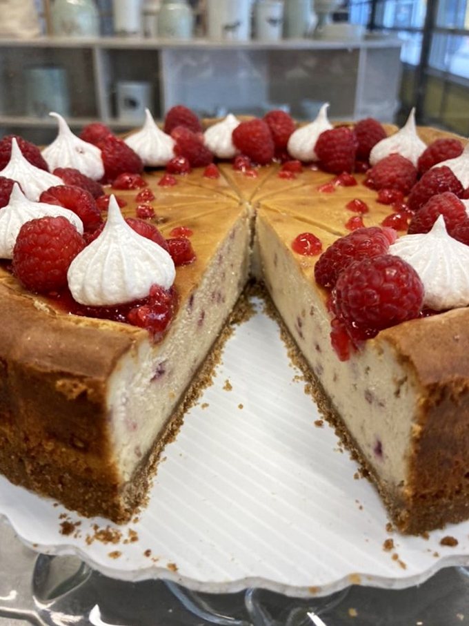This raspberry-topped cheesecake isn't just a dessert, it's an event &ndash; complete with meringue kisses standing guard around the perimeter.