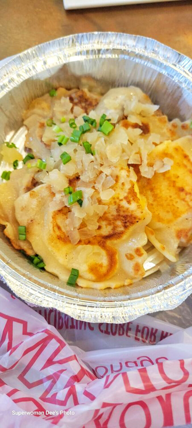 Pan-fried perfection with melted cheese and fresh chives creates a symphony of textures in every bite.