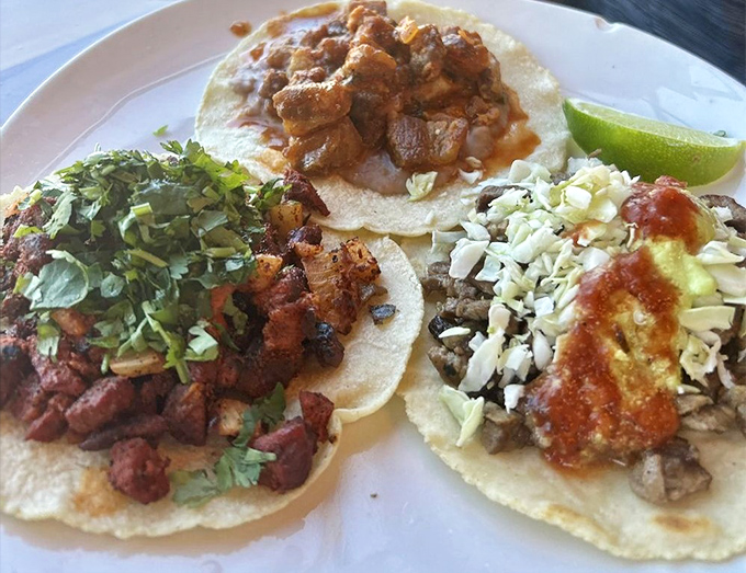 Taco heaven exists! Three distinct personalities on one plate &ndash; the crispy chicharron, savory asada, and the sweet-spicy al pastor forming the holy trinity of taco perfection.