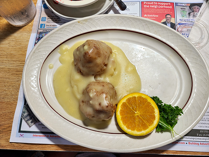 These chicken croquettes swimming in velvety sauce are what comfort food dreams are made of – grandma's recipe with a chef's execution.