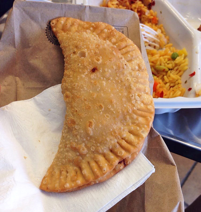 Golden, crispy, and filled with savory goodness&mdash;this empanada isn't just street food, it's street poetry in pastry form.