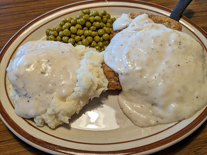 Behold the country-fried steak &ndash; a Midwestern masterpiece swimming in gravy that your cardiologist warned you about but your soul desperately needs.