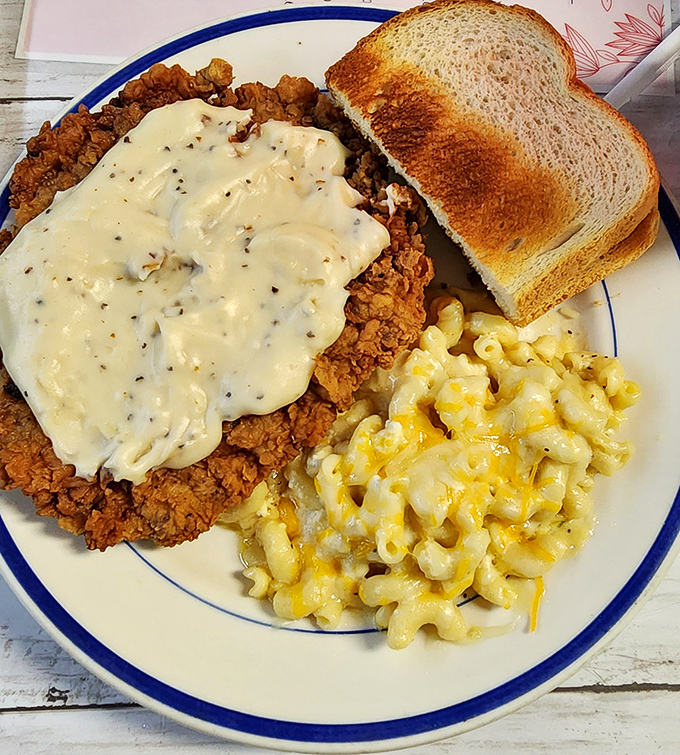 Southern comfort on a plate. That chicken fried steak under river of gravy is what dreams&mdash;and afternoon naps&mdash;are made of.