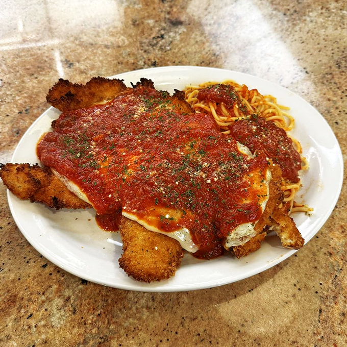 Chicken Parmesan that doesn't know it's in a diner, not an Italian restaurant. That crispy coating and melty cheese situation is serious business.