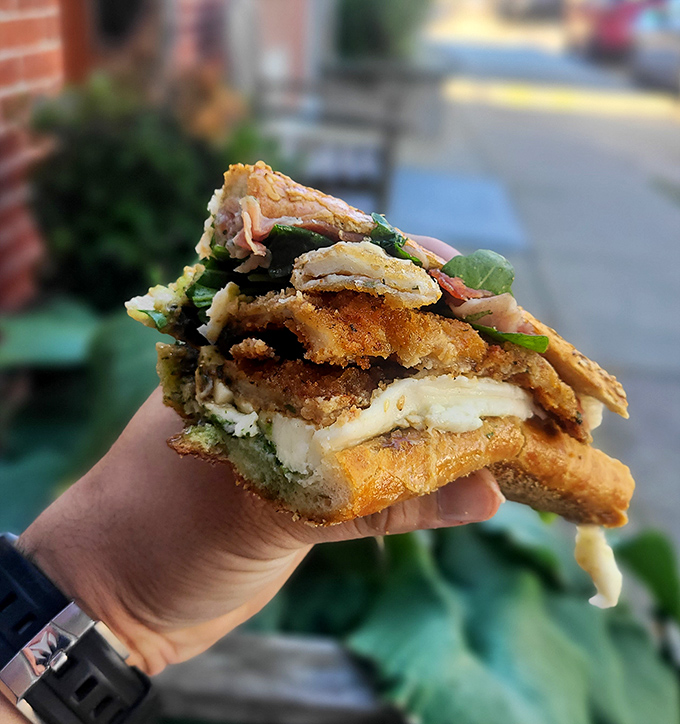 This chicken cutlet sandwich isn't just food&mdash;it's edible architecture. Crispy, gooey, and fresh elements creating the Taj Mahal of lunch options.