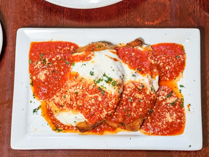 Chicken Parmigiana that doesn't just sit on the plate&mdash;it lounges luxuriously under a blanket of melted cheese and marinara like it owns the place. 