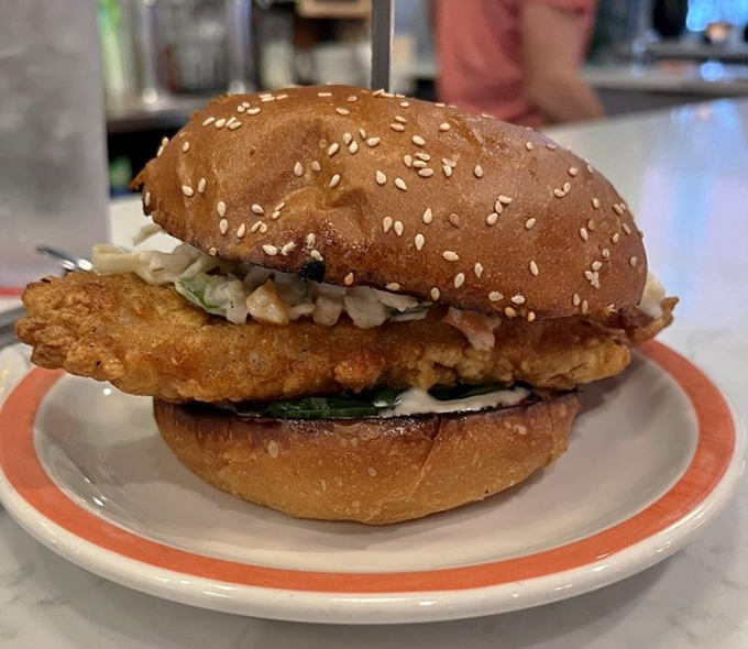 Crispy meets creamy in this chicken sandwich masterpiece. The golden-brown patty and sesame-studded bun create the comfort food upgrade you didn't know you needed.