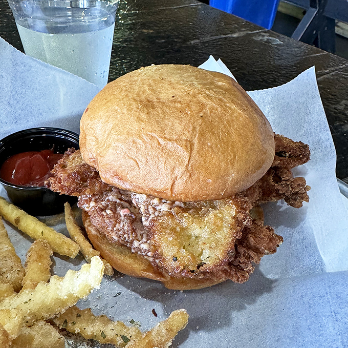 That crispy chicken sandwich towers like a delicious skyscraper, promising to satisfy even the most ambitious breakfast appetite.