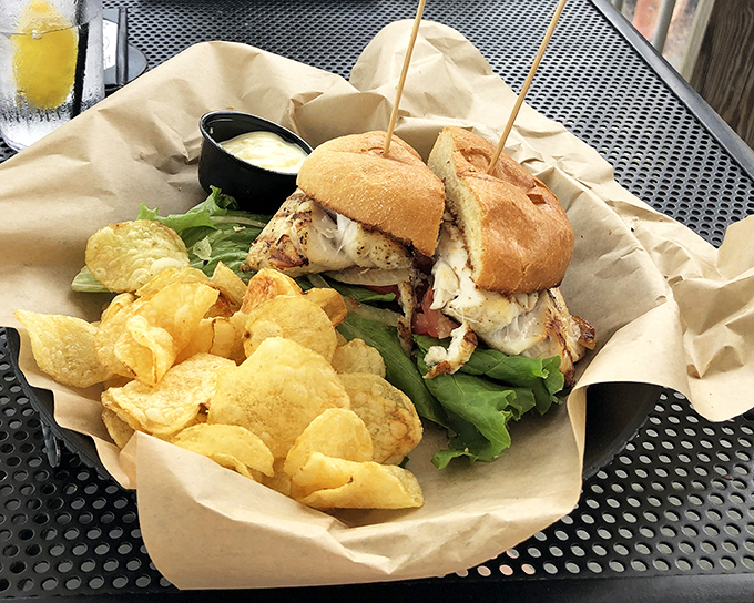 Not just a sandwich but an architectural marvel&mdash;layers of fresh fish, crisp lettuce, and soft bun creating the Taj Mahal of seafood handholds.