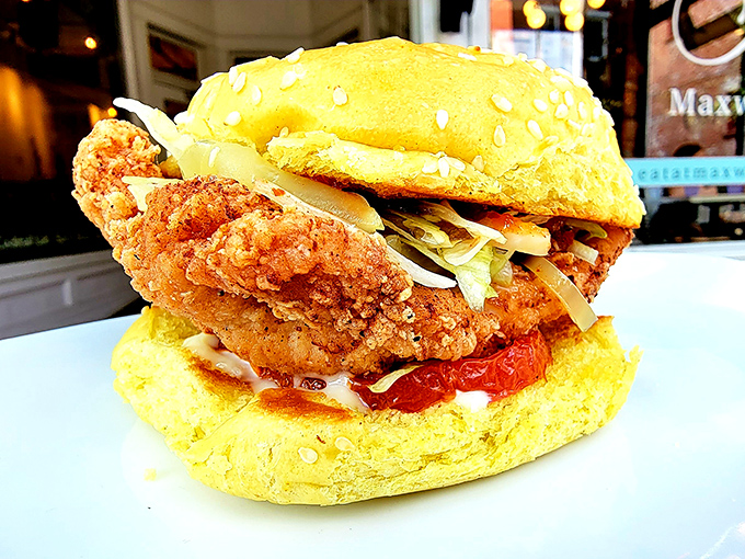 The crispy chicken sandwich that makes you question your lifelong burger loyalty. That golden-hued bun cradles its crispy treasure like it knows what it's got.