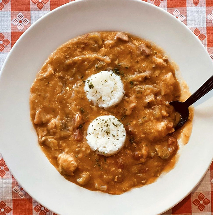 Two perfect rice islands rising from a sea of rich, hearty gumbo&mdash;proof that sometimes the best things come in unassuming bowls.