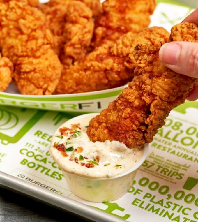 Golden-brown chicken tenders that actually taste like chicken &ndash; what a concept! Crispy outside, juicy inside, and that dipping sauce is calling your name. 