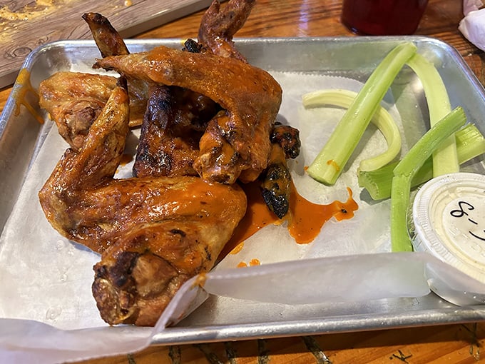 Wings that don't need a sporting event as an excuse. Glistening with sauce and served with the obligatory celery nobody actually eats.