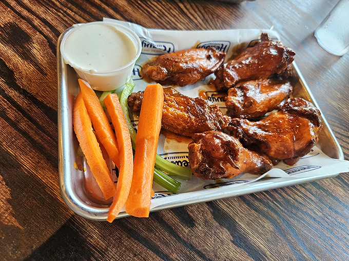 These wings aren't flying anywhere except into flavor town. That glistening sauce practically winks at you, promising a delicious commitment.