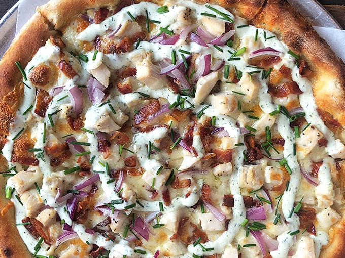 This chicken bacon ranch pizza isn't just a meal&mdash;it's a masterclass in balance, with perfectly blistered crust supporting a harmony of toppings and fresh herbs.
