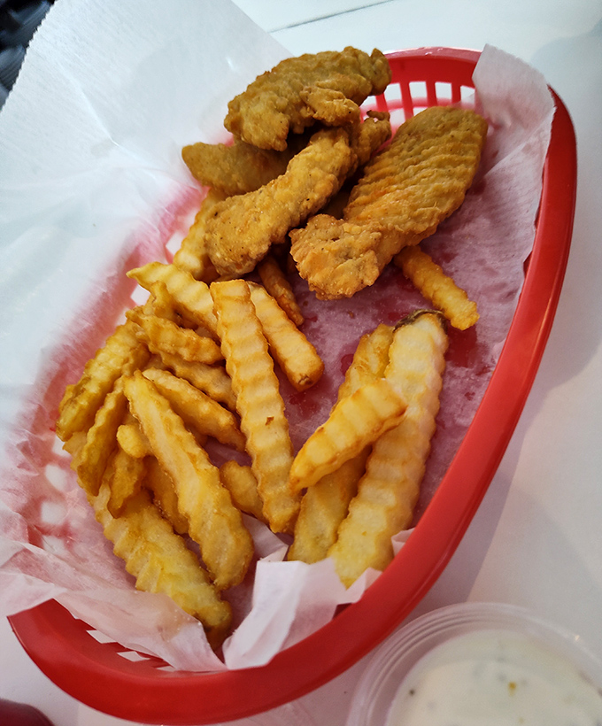 Golden-battered chicken fingers and crinkle-cut fries &ndash; proof that some childhood favorites deserve permanent spots in our adult dining repertoire.