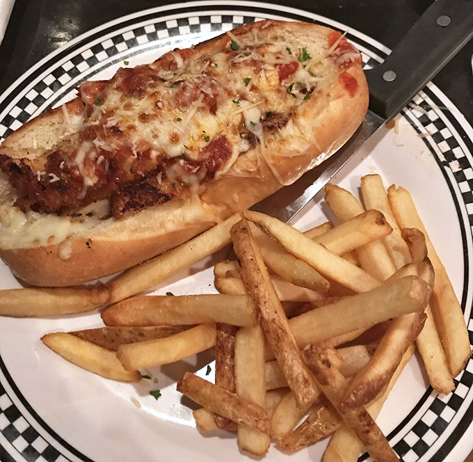 This chicken parm sandwich is what happens when Italian comfort food meets deli craftsmanship. Those fries aren't just a side&mdash;they're worthy companions.