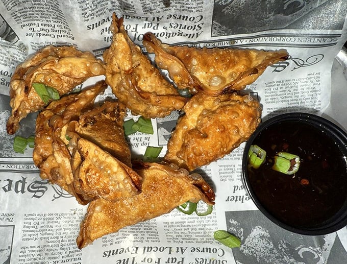 Potstickers that could start a religion &ndash; crispy-bottomed, tender-topped, and served with a sauce that makes you want to drink it straight.