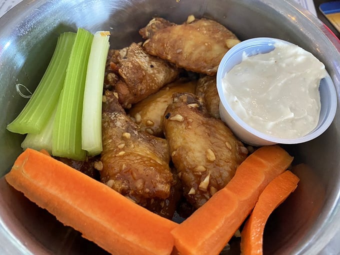 Whoever said chicken wings couldn't be sophisticated hasn't seen this presentation&mdash;crispy morsels accompanied by garden-fresh veggies and house-made dip.