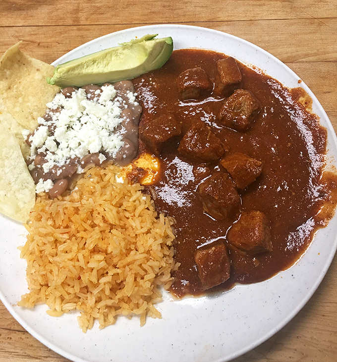 Chile Colorado that deserves its own zip code. Rich, complex, and soul-satisfying with tender meat that surrenders at the touch of a fork.