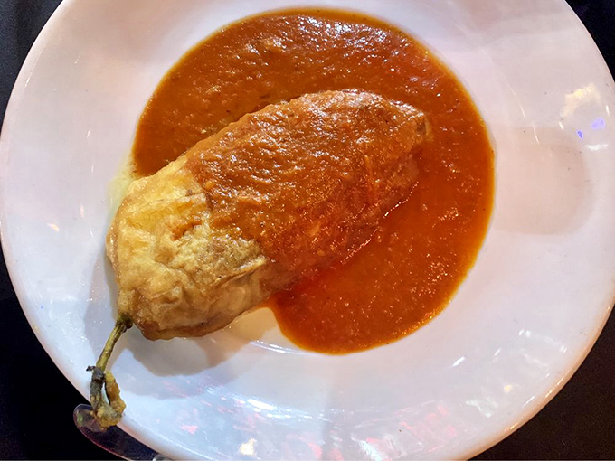 A chile relleno that's been given the royal treatment&mdash;egg-battered, cheese-crowned, and swimming in a sauce that's been simmering since sunrise.