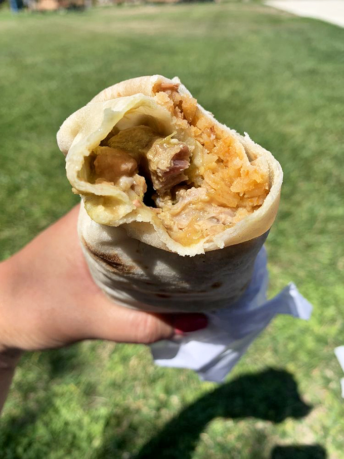 The Chile Verde burrito, enjoyed al fresco&mdash;proof that sometimes the best dining room is wherever you happen to be when hunger strikes.