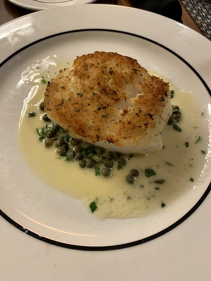This Chilean Sea Bass is having a better spa day than most humans&mdash;bathed in butter, caressed with capers, and pampered with fresh herbs.