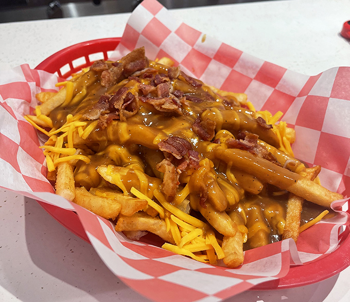Cheese fries elevated to an art form. That bacon sprinkled on top isn't just a garnish&mdash;it's the crown jewels of this comfort food kingdom. 