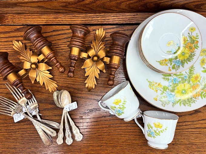 Delicate china with yellow floral patterns paired with ornate gold accents—Sunday dinners were serious business when these were new.