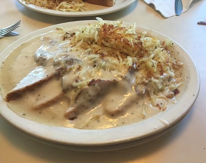 Comfort food that hugs you from the inside. This creamy chipped beef blankets those crispy hash browns like a warm embrace on a cold morning.