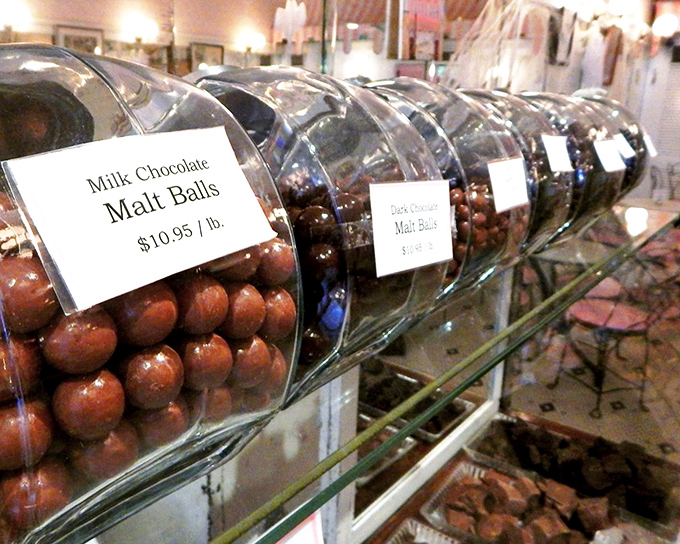 Chocolate malt balls lined up like delicious soldiers, ready to sacrifice themselves for your moment of pure cocoa bliss.